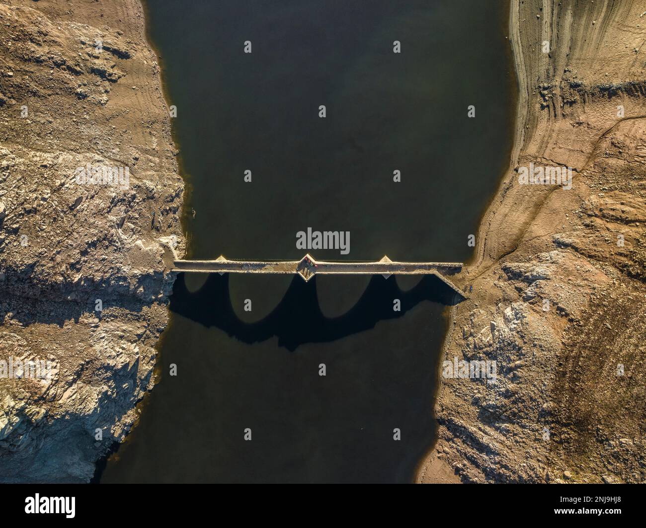 Aerial view of the medieval bridge of Querós, in the Susqueda reservoir ...