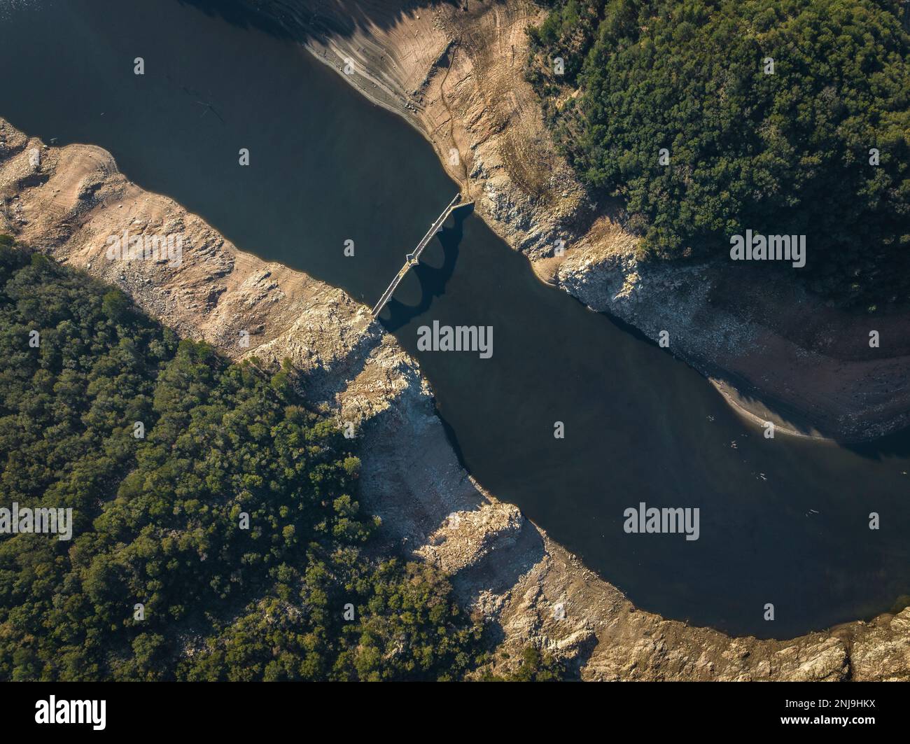 Aerial view of the medieval bridge of Querós, in the Susqueda reservoir ...