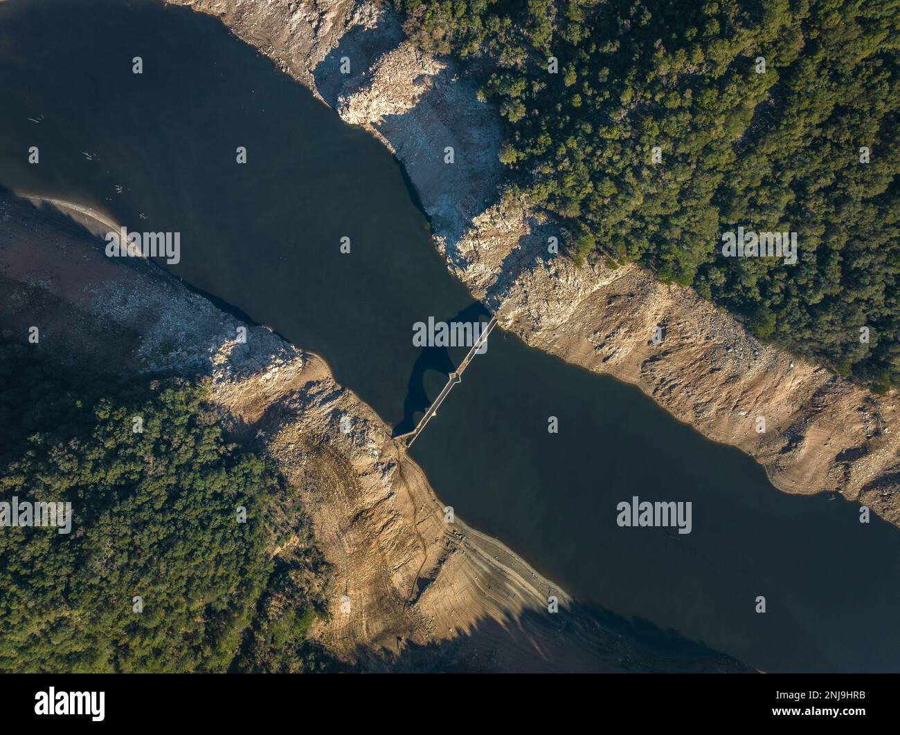 Aerial view of the medieval bridge of Querós, in the Susqueda reservoir ...