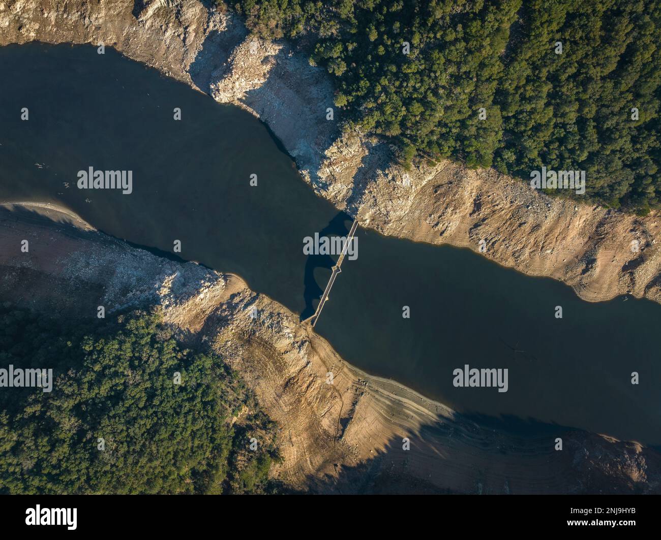 Aerial view of the medieval bridge of Querós, in the Susqueda reservoir ...