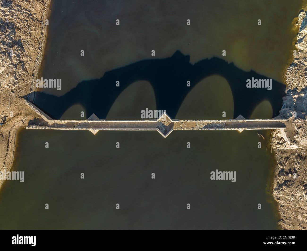 Aerial view of the medieval bridge of Querós, in the Susqueda reservoir ...