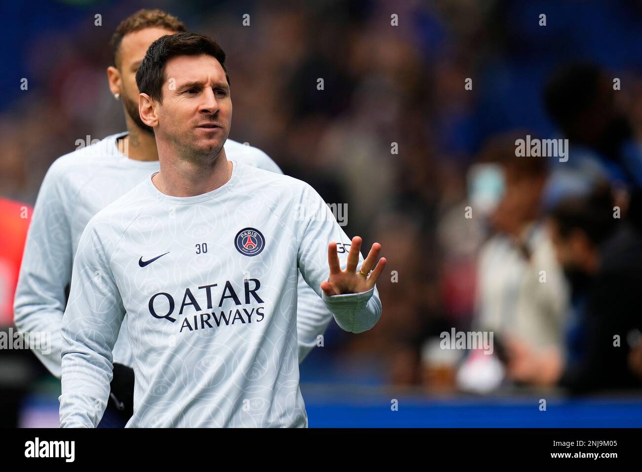 PARIS, FRANCE - FEBRUARY 19: Leo Messi waves at some fans during warm ...