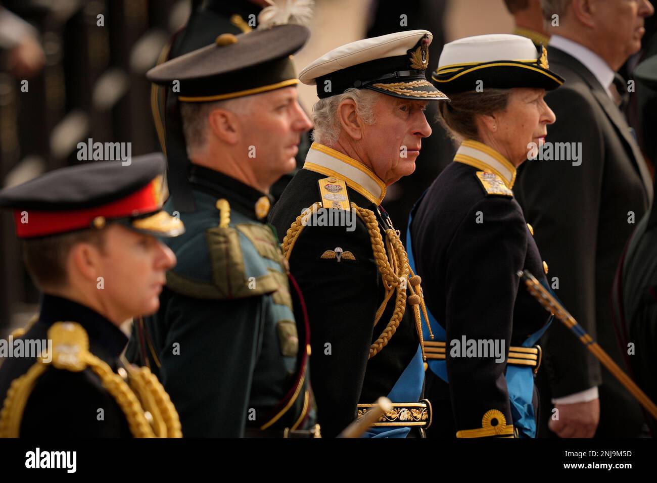 King Charles III and Princess Anne, right, follow the coffin of Queen ...