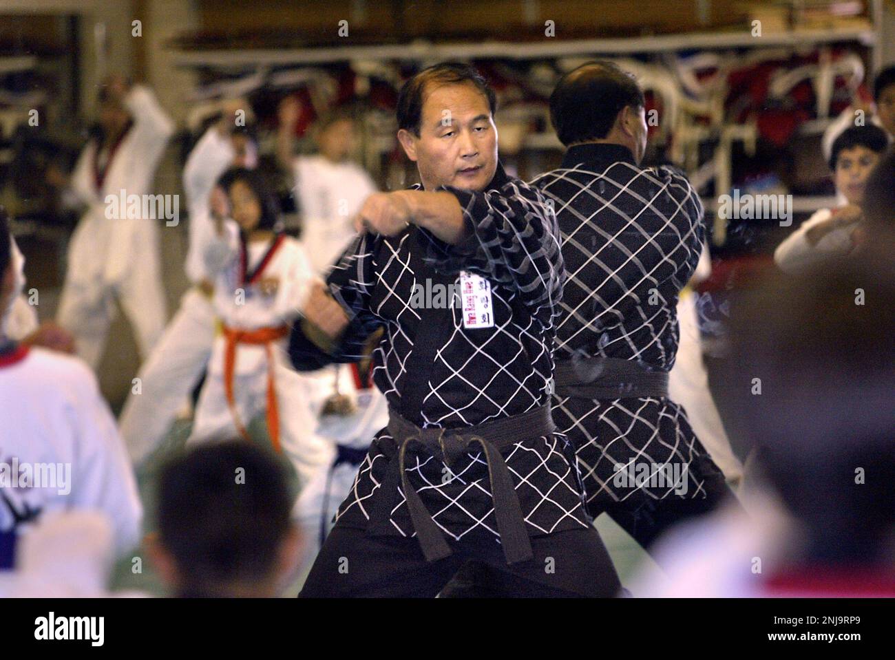 TAEKWONDO 135LH.JPG Grand Master D.K. Shin (middle), considered the ...