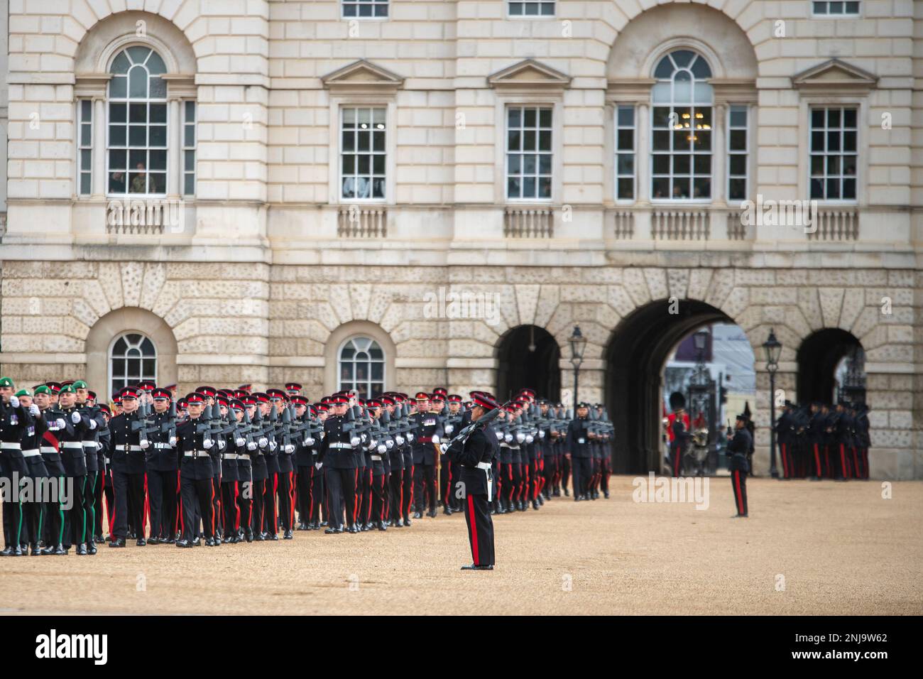 Members of the British Royal Guard passing through Horseguards Parade ...