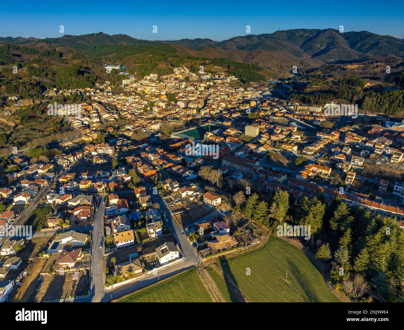 Aerial view of the town of Sant Hilari Sacalm in the morning and the ...