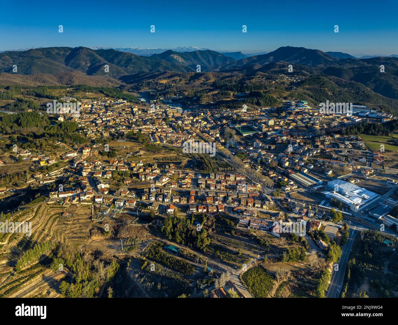 Aerial view of the town of Sant Hilari Sacalm in the morning and the ...