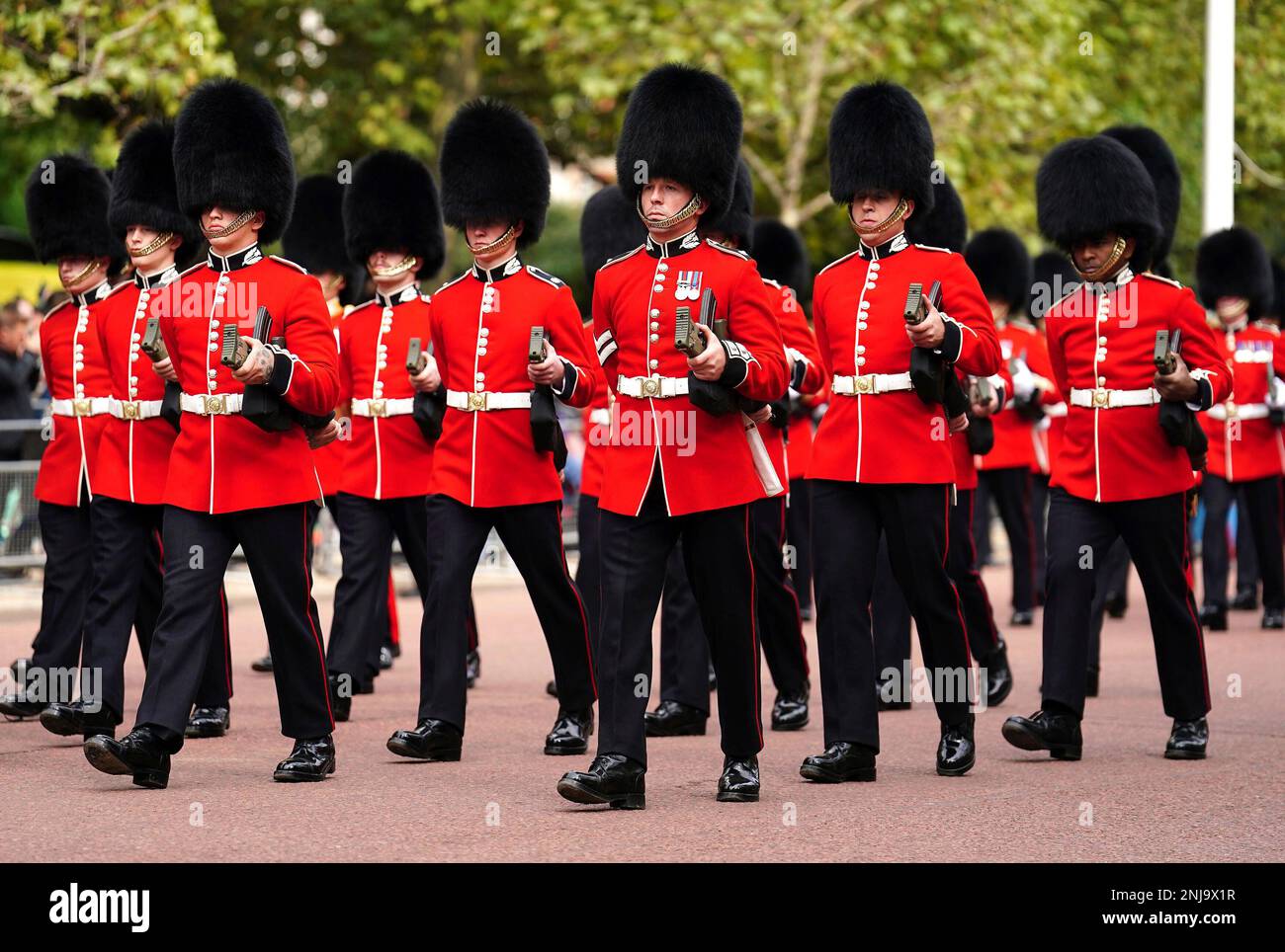 Members of the military march in the Ceremonial Procession of Queen ...