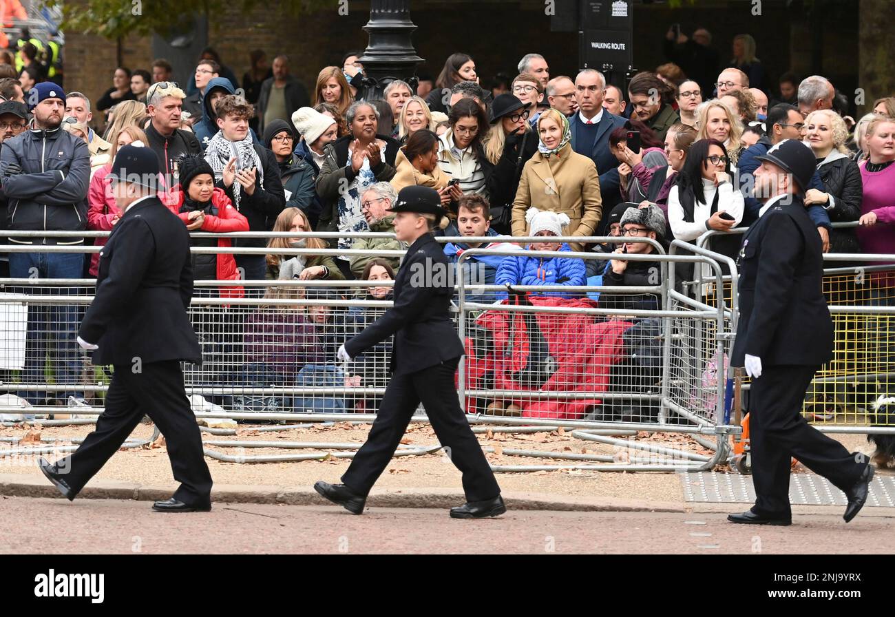 People wait for the hearse procession in London on Sept.19, 2022. Queen ...