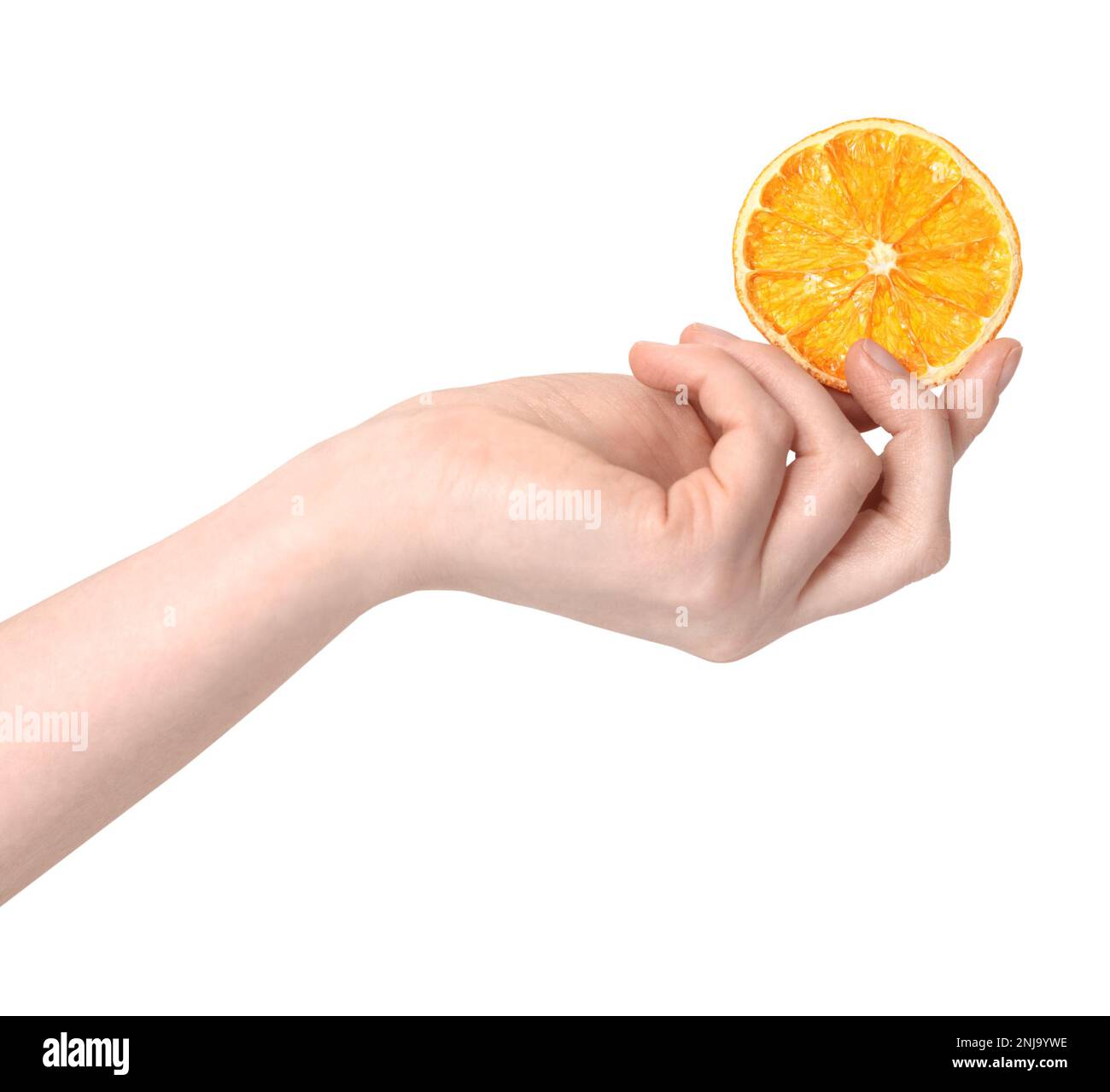 dried slice of orange in hand isolated on white background Stock Photo ...