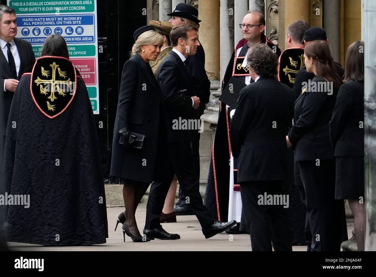 French President Emmanuel Macron and his wife Brigitte enter ...