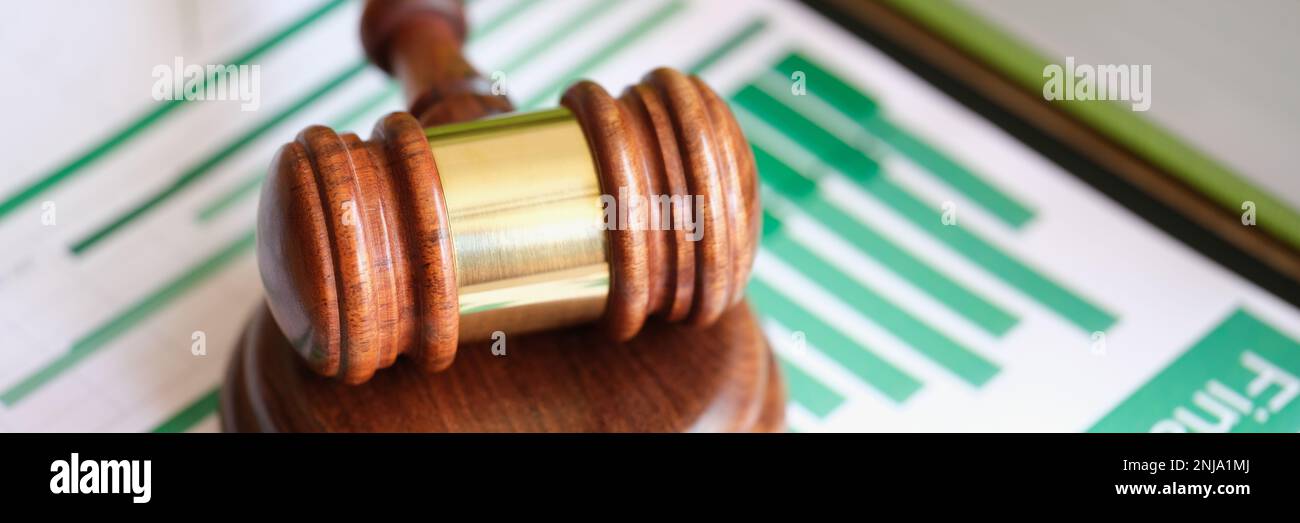 Financial statements in charts and court gavel Stock Photo - Alamy
