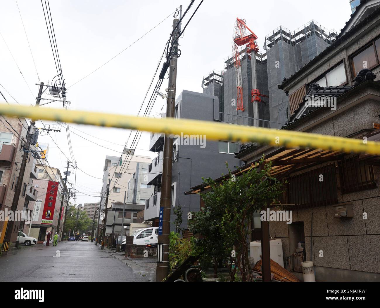 A crane tilts due to a heave storm in Kagoshima Prefecture on Sept. 19 ...