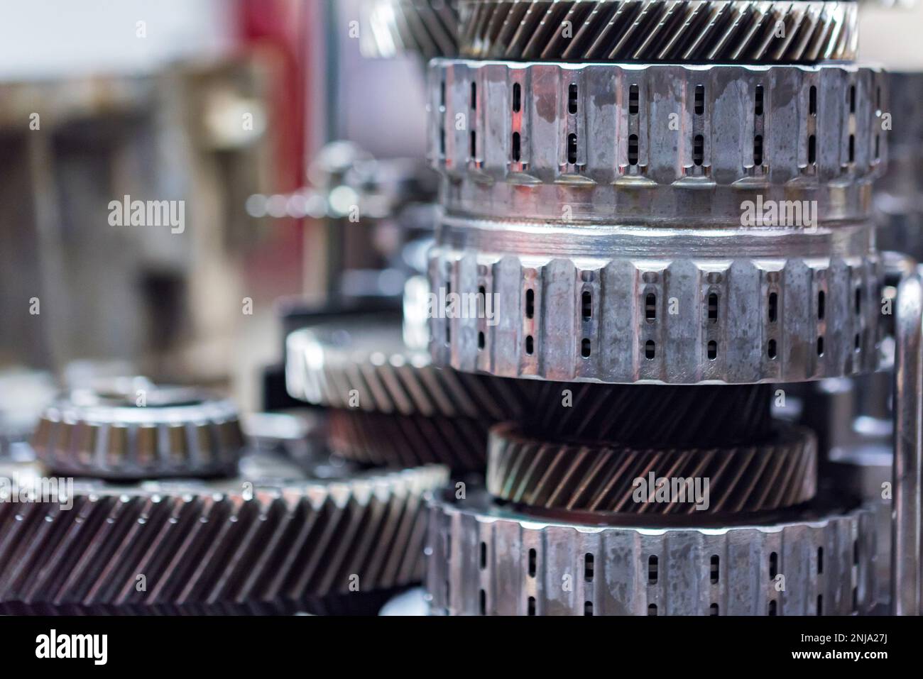 Planetary gearsets inside vehicle automatic transmission. Close up view in mechanic workshop ...