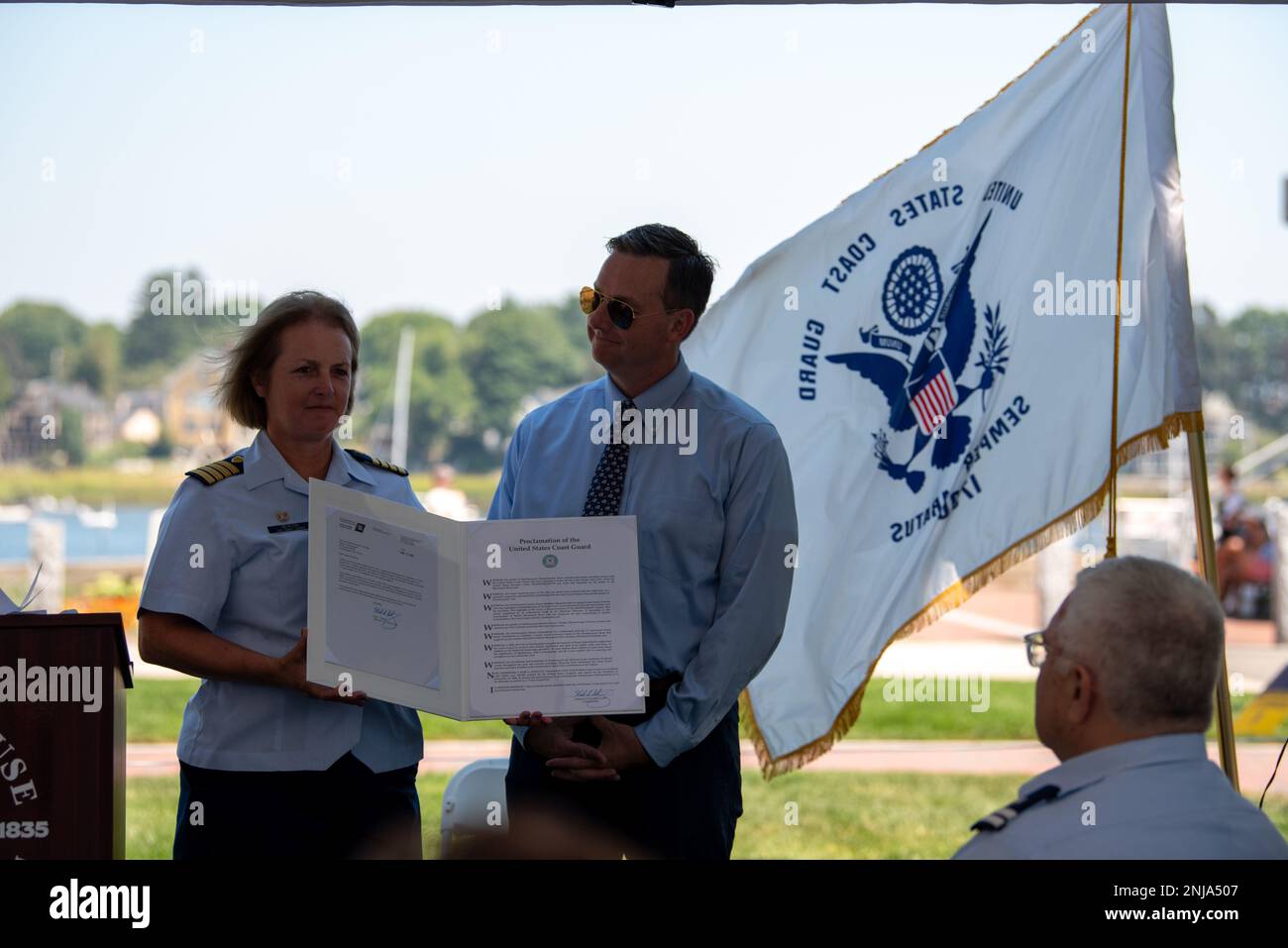 Capt. Kailie Benson, commander Coast Guard Sector Boston, and Sean ...