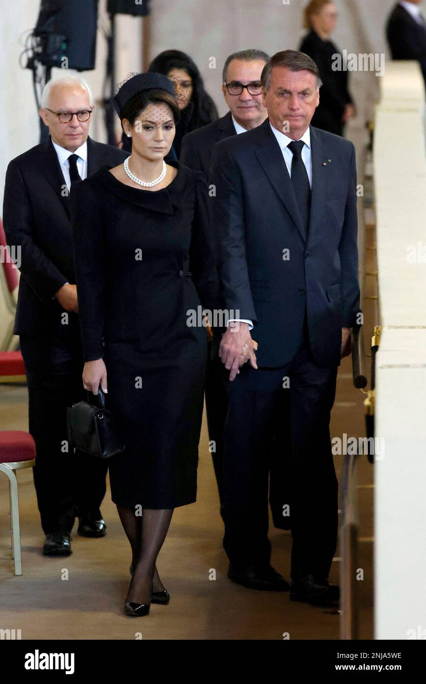 President Jair Bolsonaro of Brazil, right, and his wife Michelle pay ...