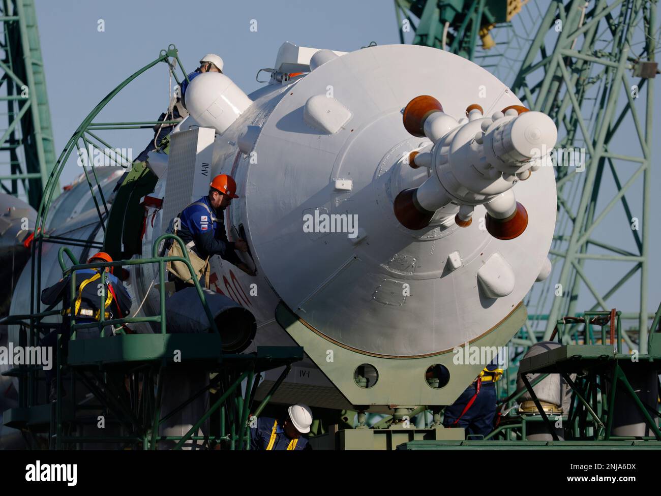 Engineers prepare the Russia's Soyuz-2.1 booster rocket with the Soyuz ...
