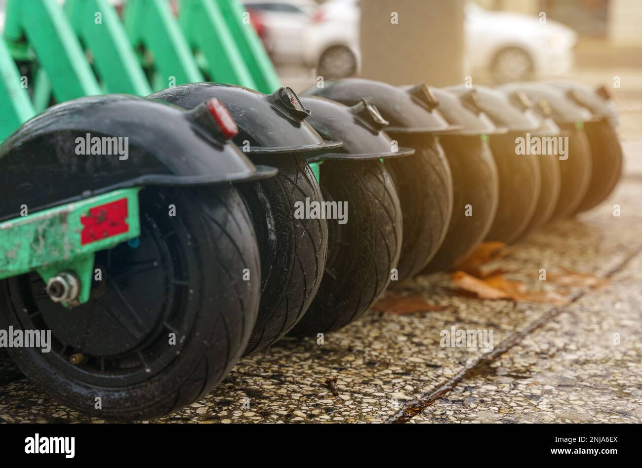Electric scooters for public use, rear wheel view. Public transport ...