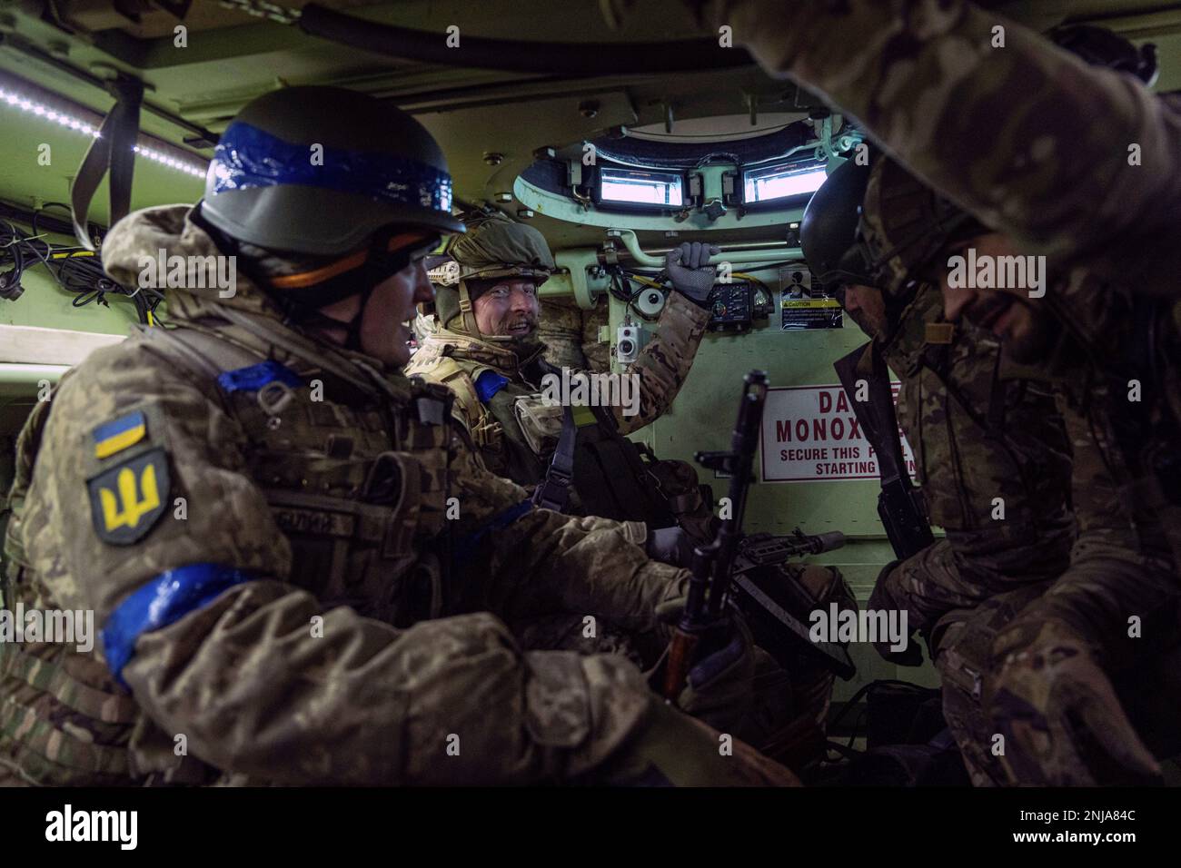 Ukrainian servicemen of 68 OleksaDovbush hunting brigade ride inside of ...