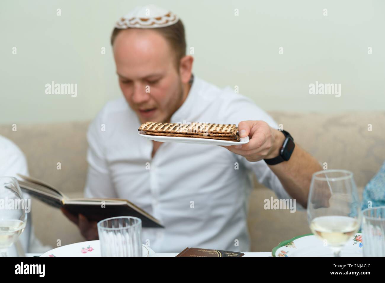 Jewish young man with flatbread Matzah - unleavened flatbread in ...