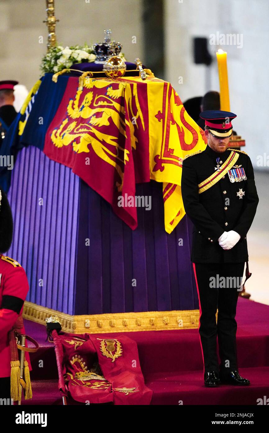 Prince Harry participates in the vigil of the Queen's grandchildren ...