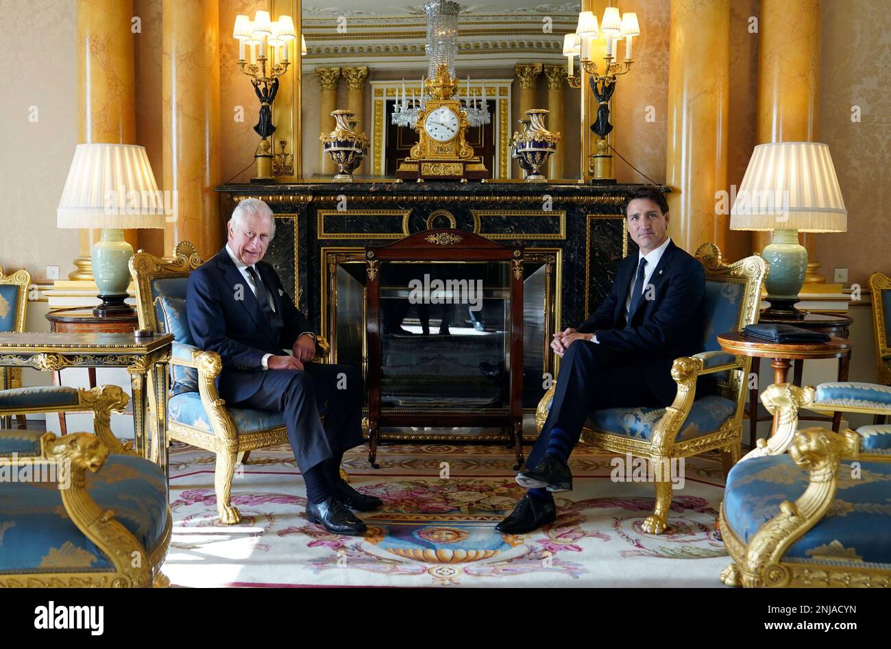 Britain's King Charles III sits with Prime Minister of Canada Justin ...