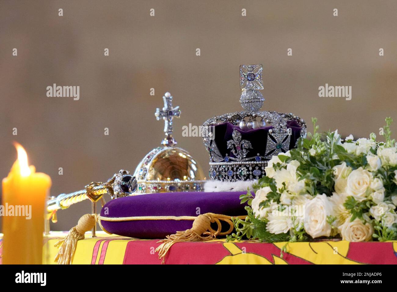The Imperial State Crown and the Sovereign's orb and sceptre are seen ...