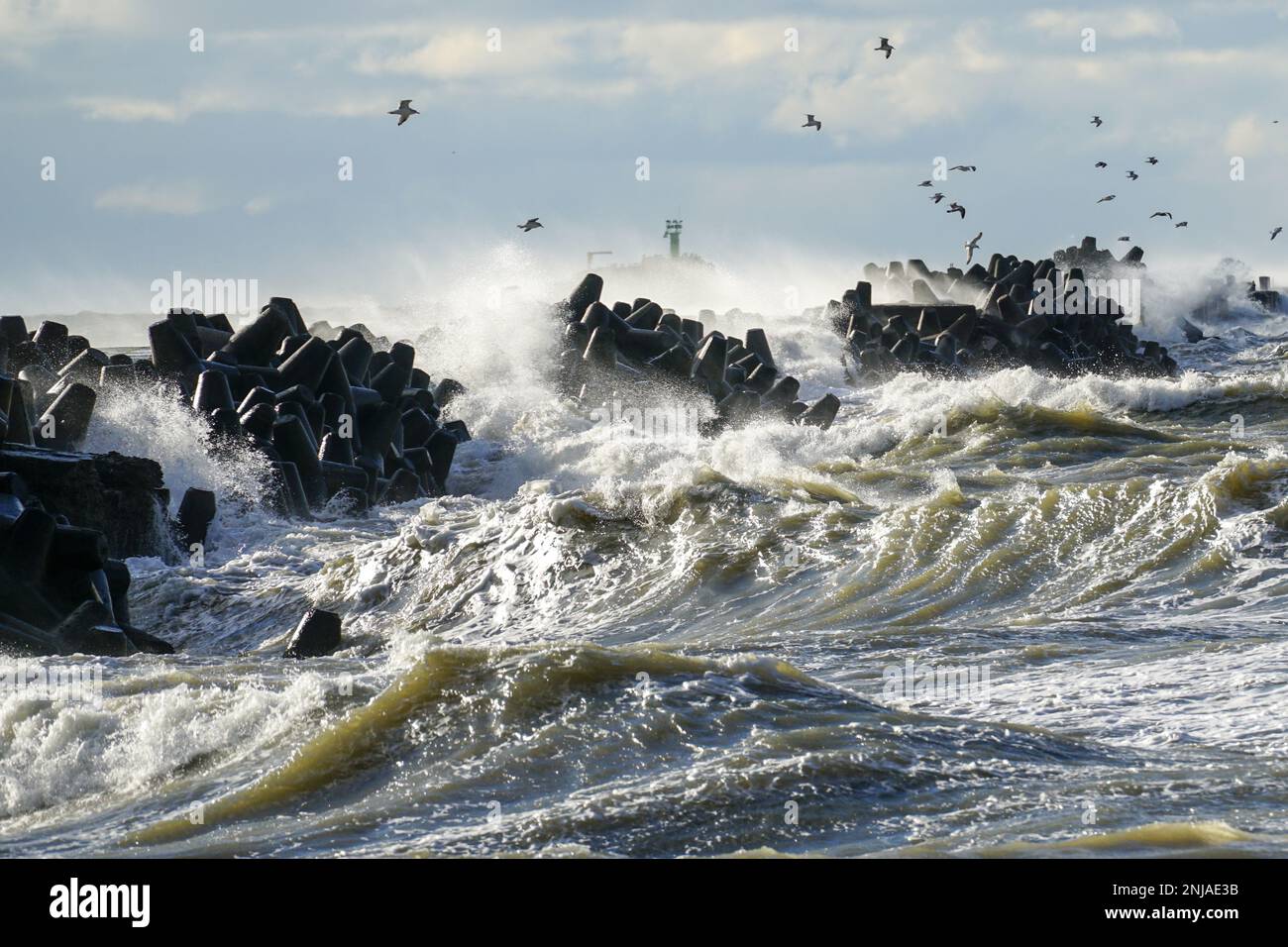 Coastal storm in the Baltic Sea, big waves crash against the concrete ...