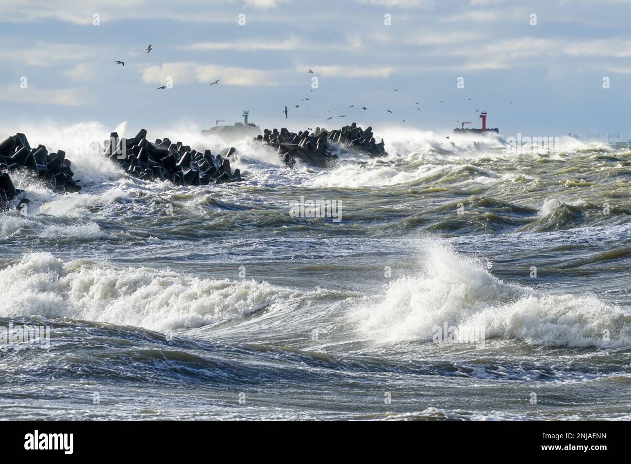 Coastal storm in the Baltic Sea, big waves crash against the concrete ...
