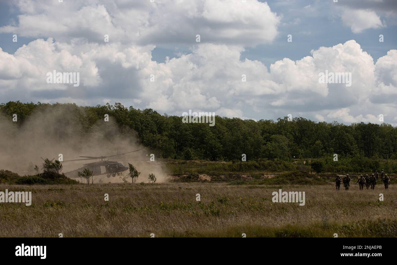Operators from the 20th Special Forces Group conduct an aerial assault ...