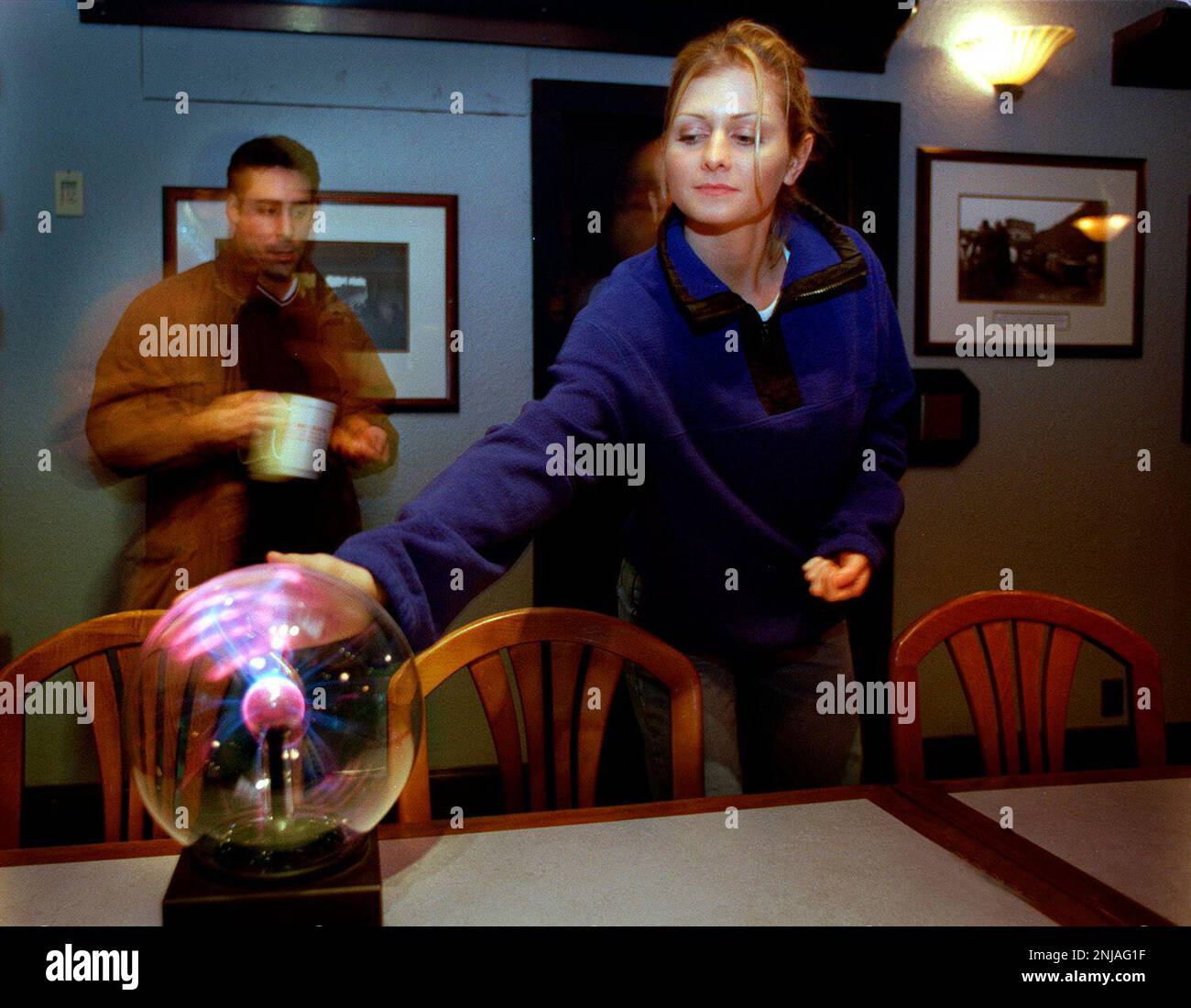 PNGHOST 3/C/05FEB99/PF/LH--Kalin Olson (right) checks out a storm ball ...