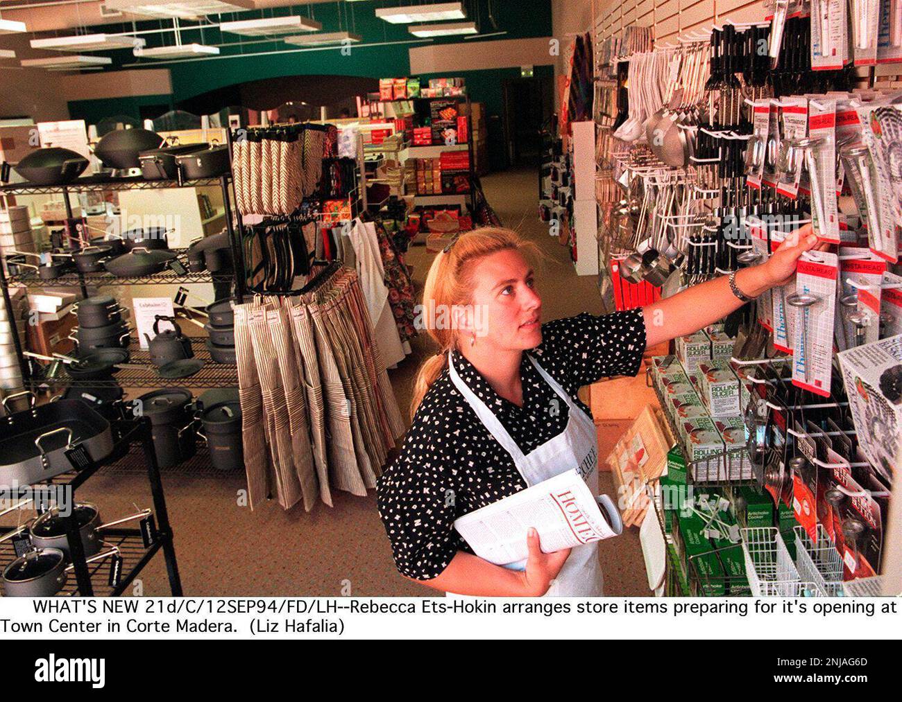 REBECCA ETS-HOKIN ARRANGES STORE ITEMS IN PREPARING FOR THE OPENING OF ...