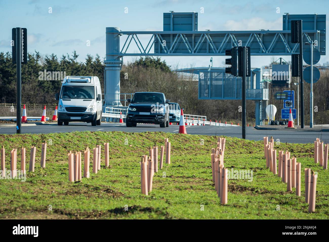 Cars and trucks stopped at junction traffic light on motorway in ...