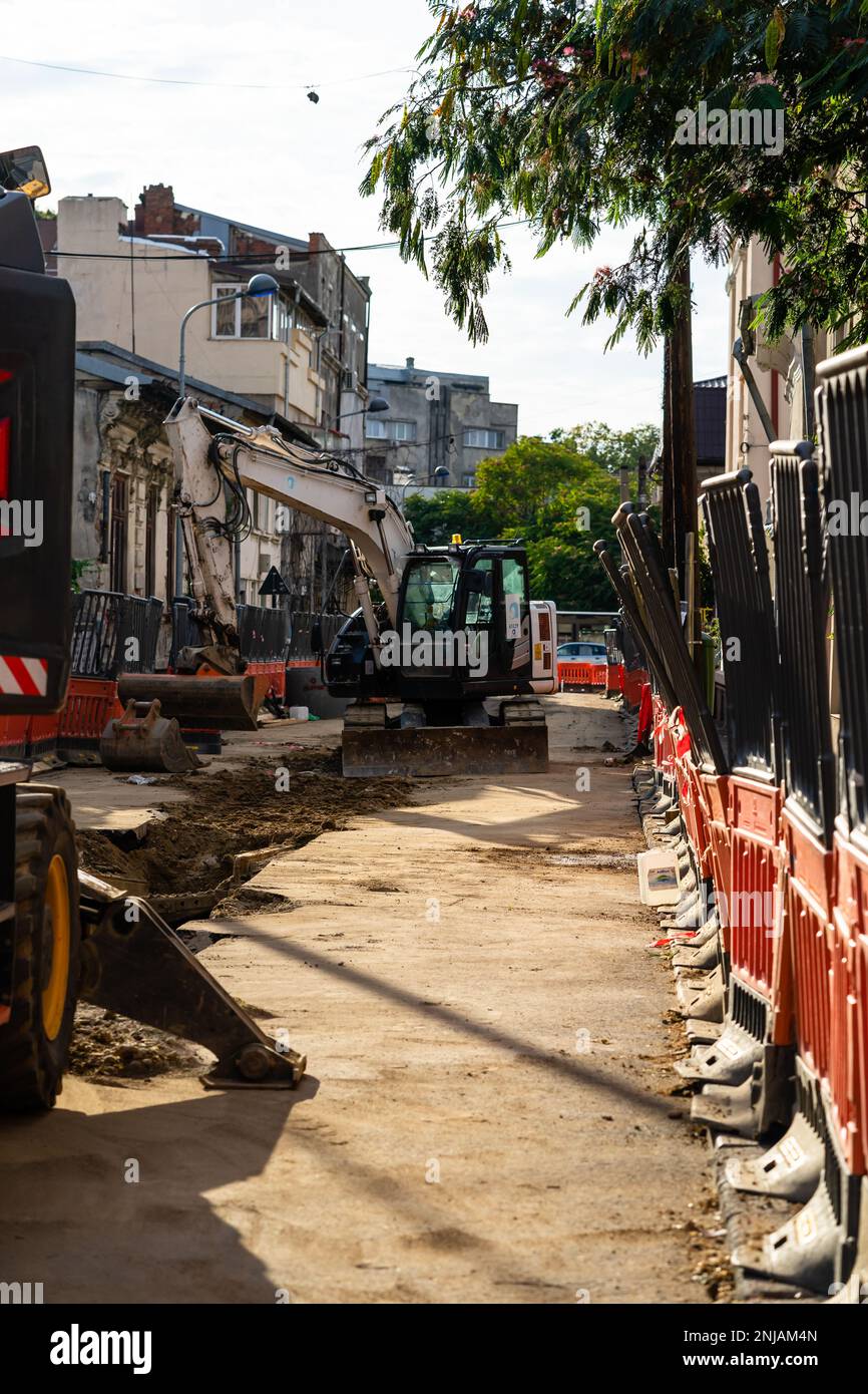 Construction workers at construction site and heavy duty bulldozer in ...
