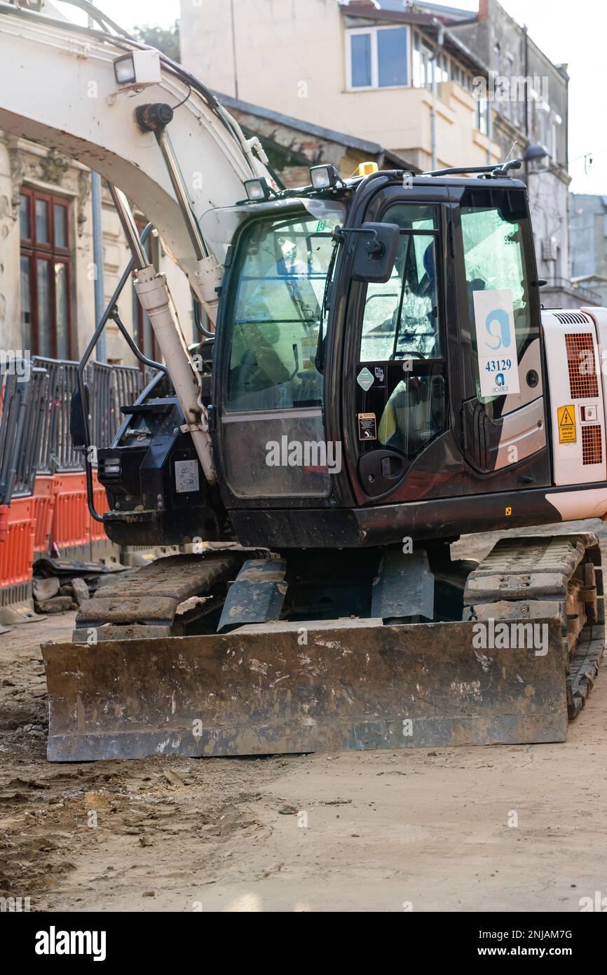 Construction workers at construction site and heavy duty bulldozer in ...