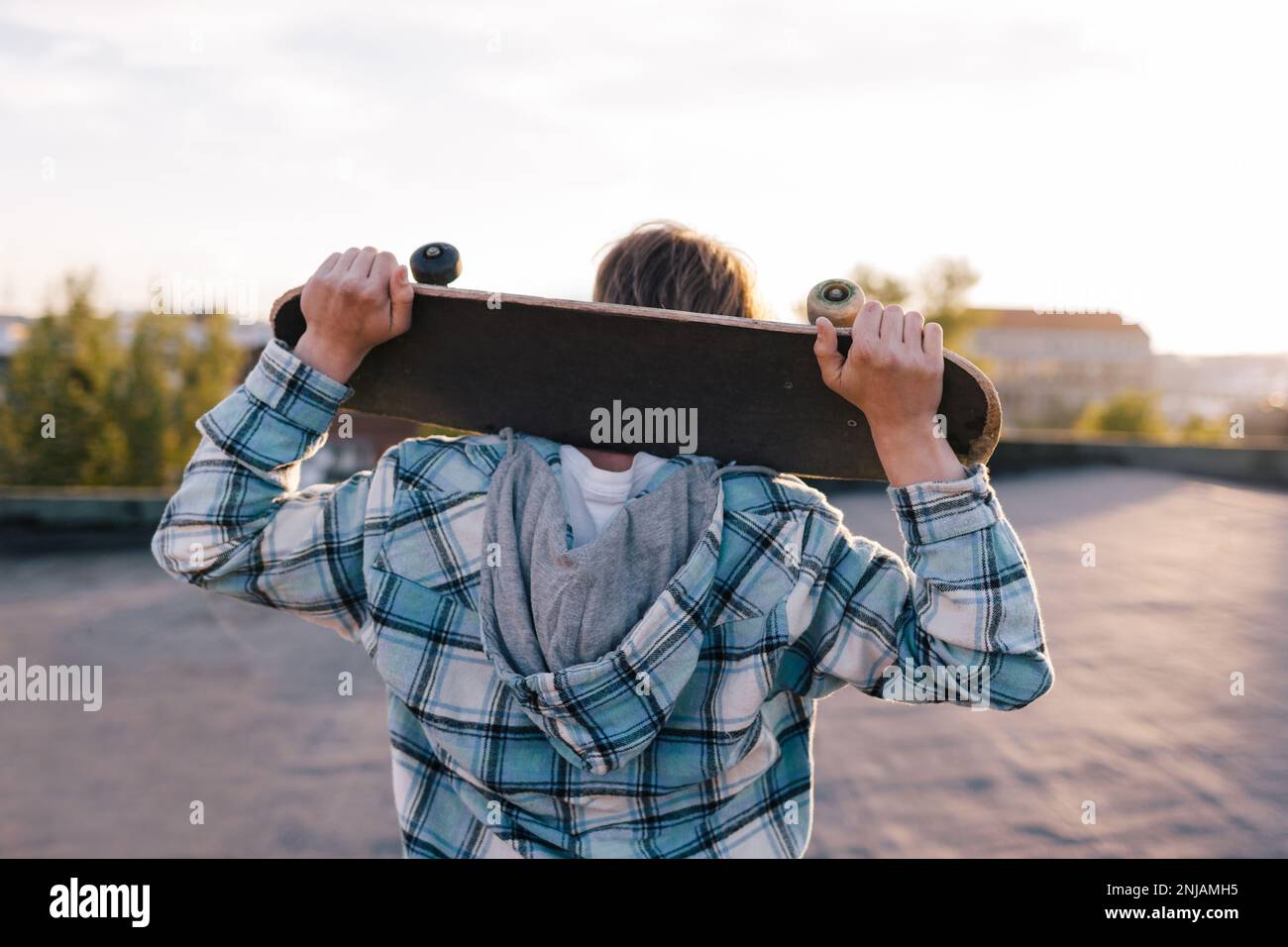 Street subculture. Skateboarder with skateboard Stock Photo - Alamy