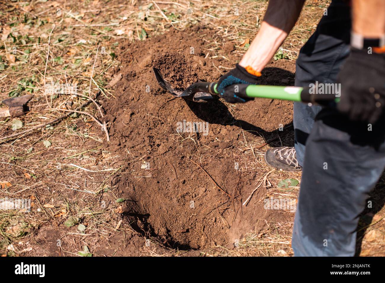 Man holding a shovel hi-res stock photography and images - Alamy