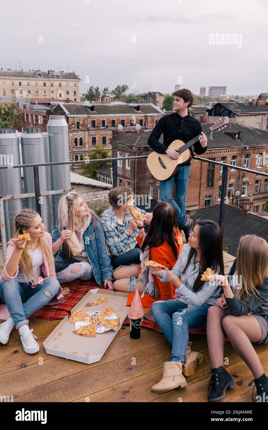 Party friends with junk food Stock Photo - Alamy