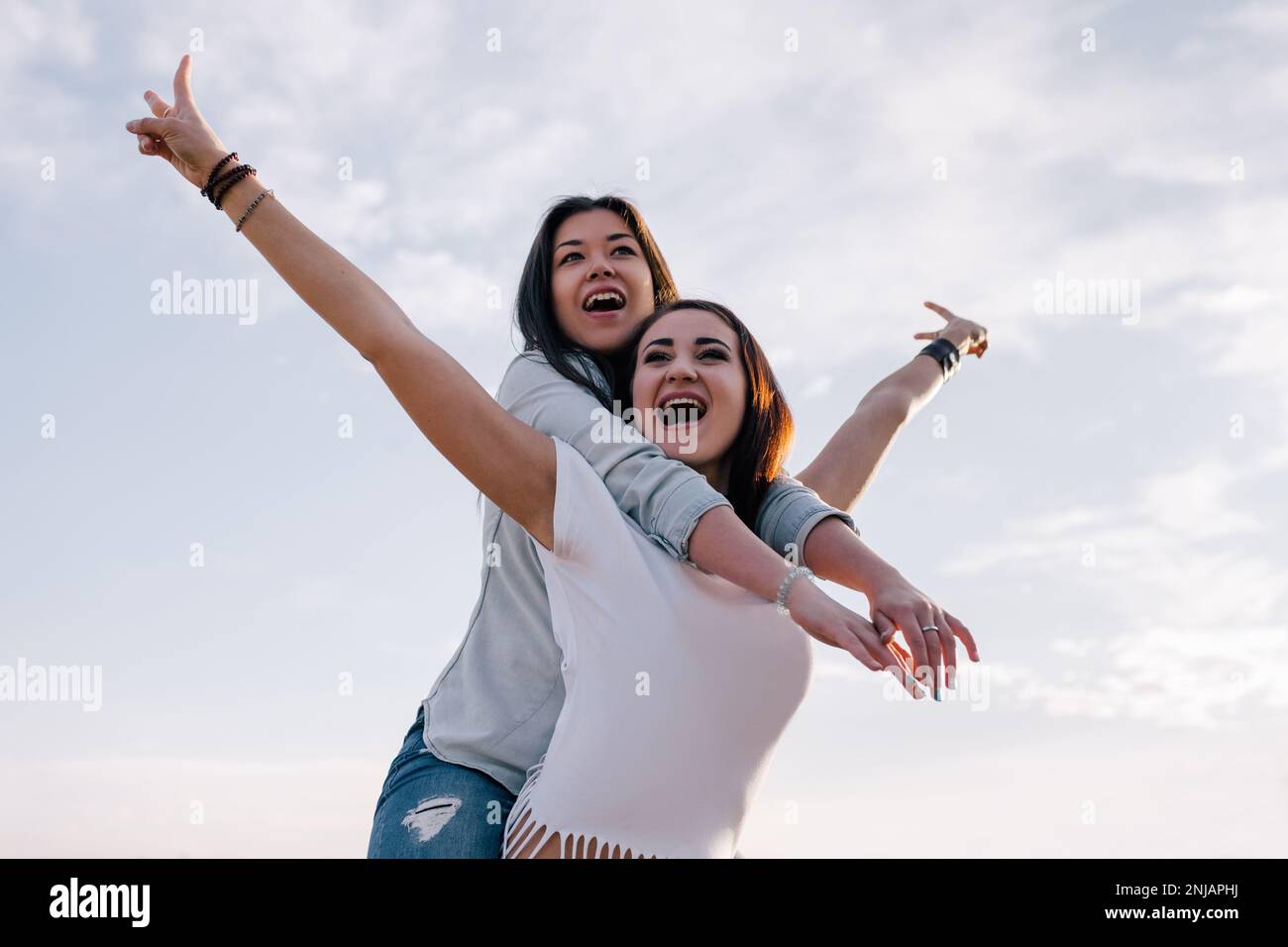 Victory in female friendship. Happy girls Stock Photo - Alamy