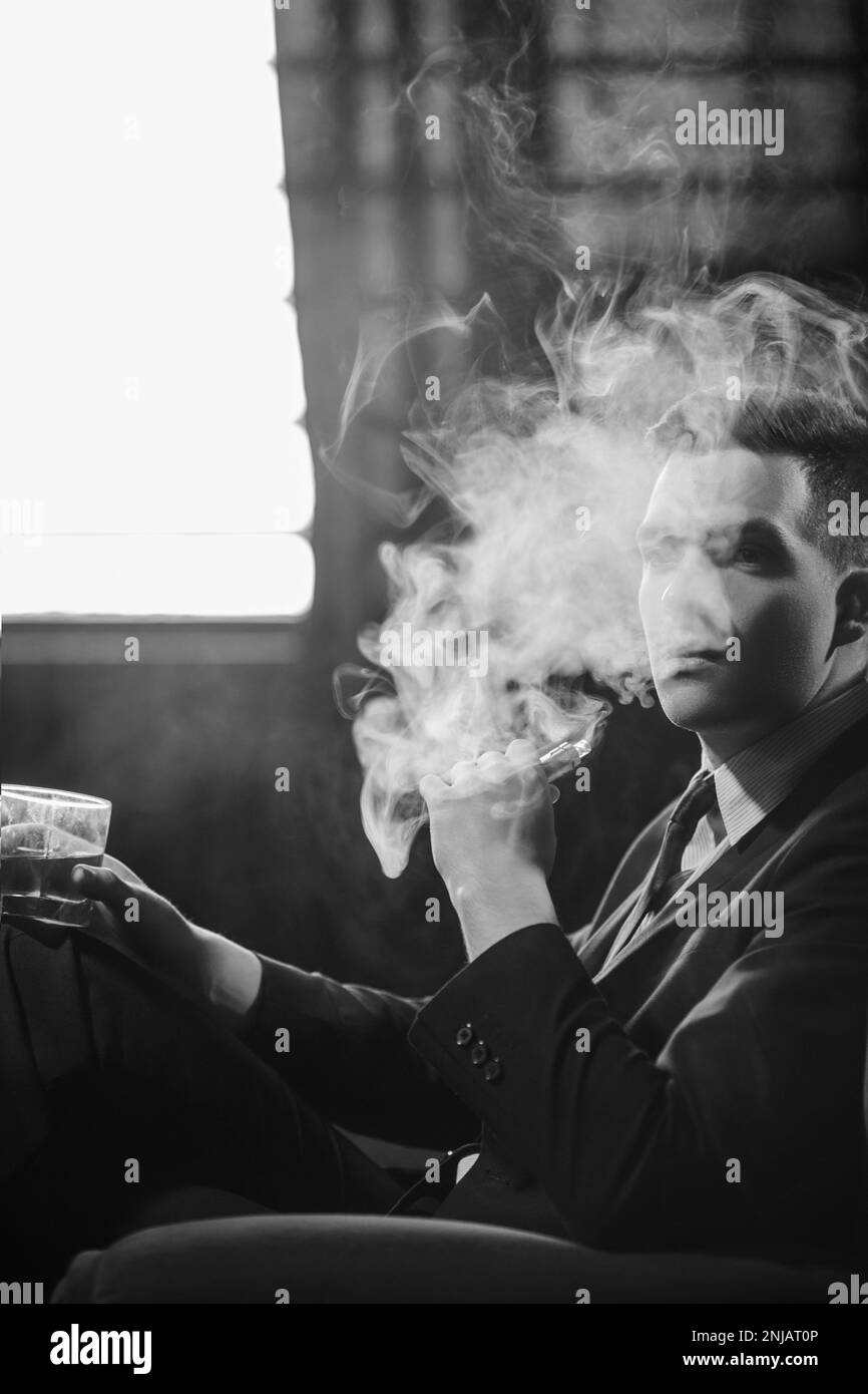 successful man enjoying life smoking drink Stock Photo - Alamy