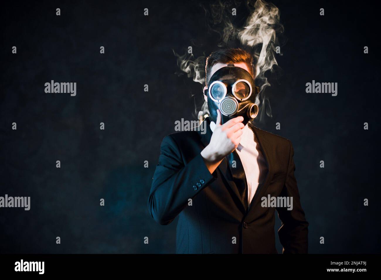 man gas mask nicotine cloud passive smoker danger Stock Photo - Alamy