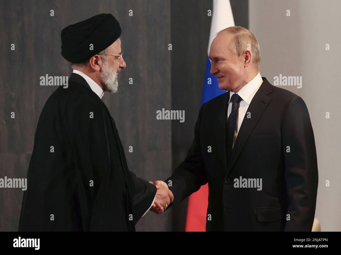 Russian President Vladimir Putin, right, and Iranian President Ebrahim ...