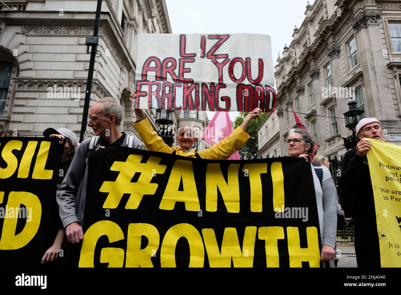 A man holds a banner during an Extinction Rebellion protest to compel ...