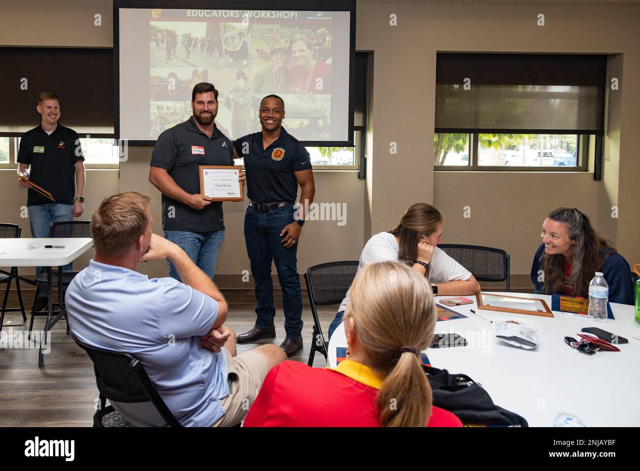 U.S. Marine Corps Maj. Kenneth Jackson, right, the commanding officer ...