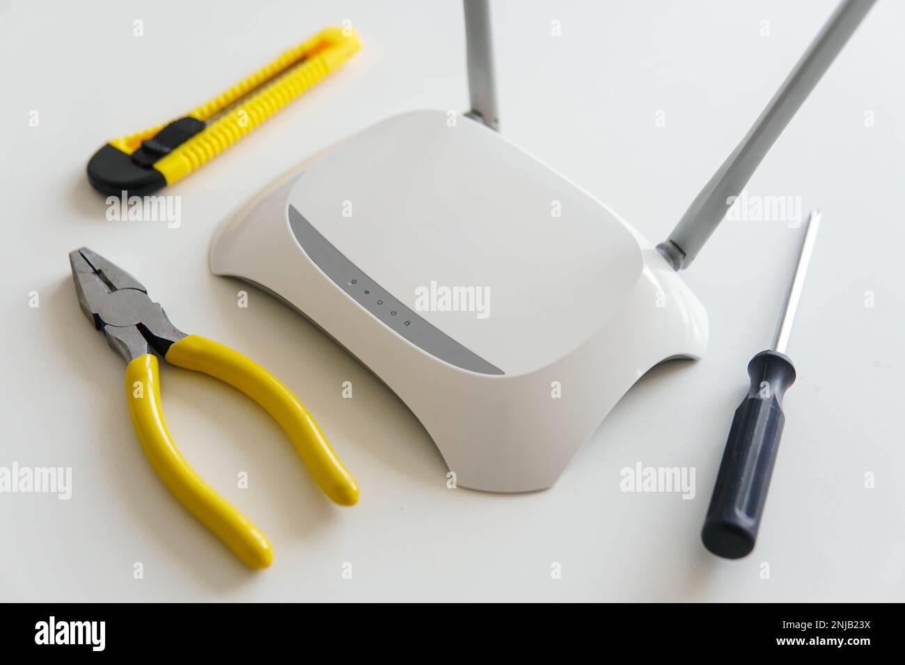 Repairing tools with a wireless wifi router on the table Stock Photo ...
