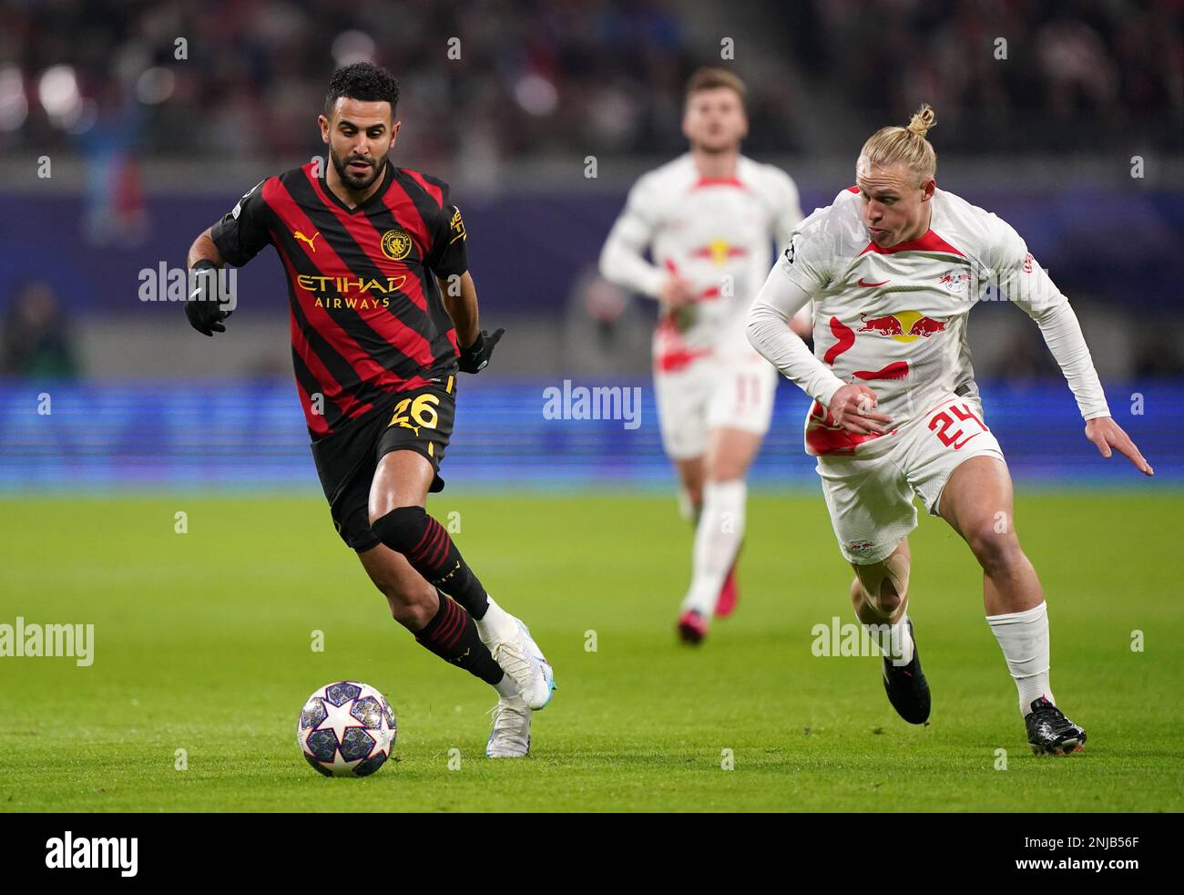 Manchester City's Riyad Mahrez (left) and RB Leipzig's Xaver Schlager ...