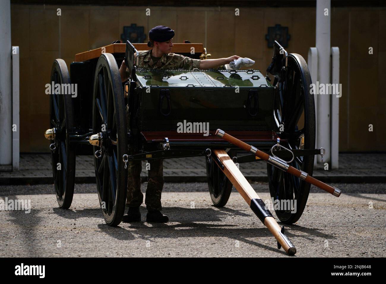 A member of the military cleans a gun carriage as they make their final preparations, ahead of ...