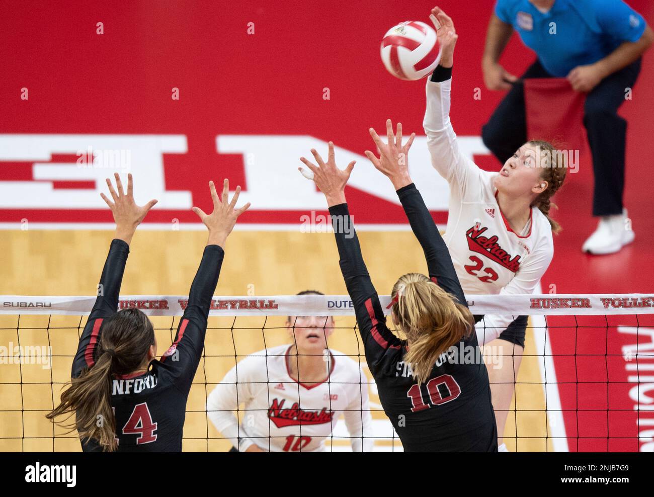 Nebraska's Lindsay Krause (22) hits a ball past Stanford's Kendall Kipp ...