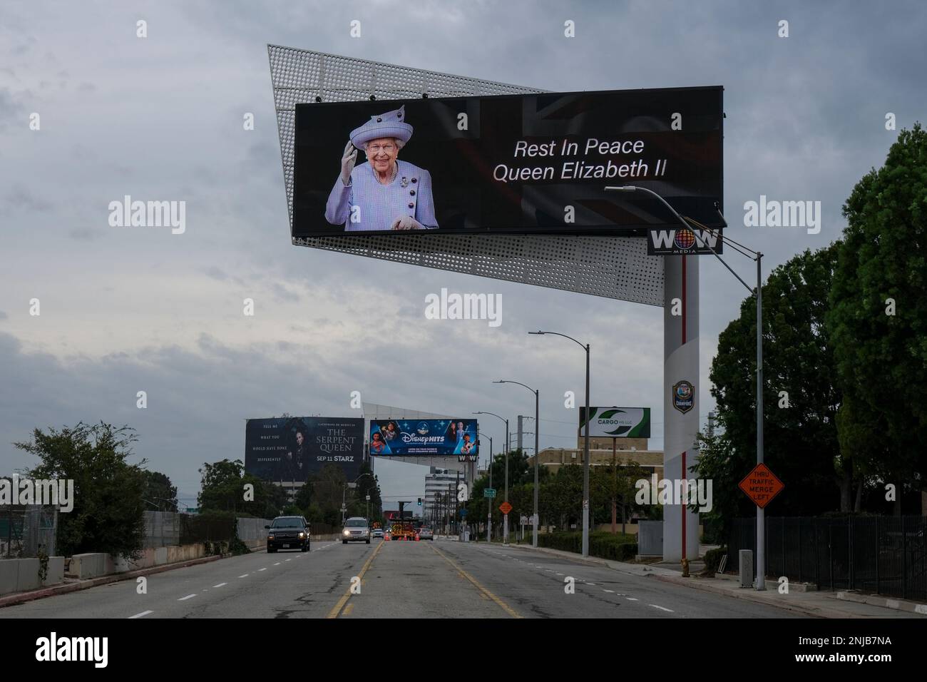 A billboard honoring Queen Elizabeth II with the words "Rest in Peace ...