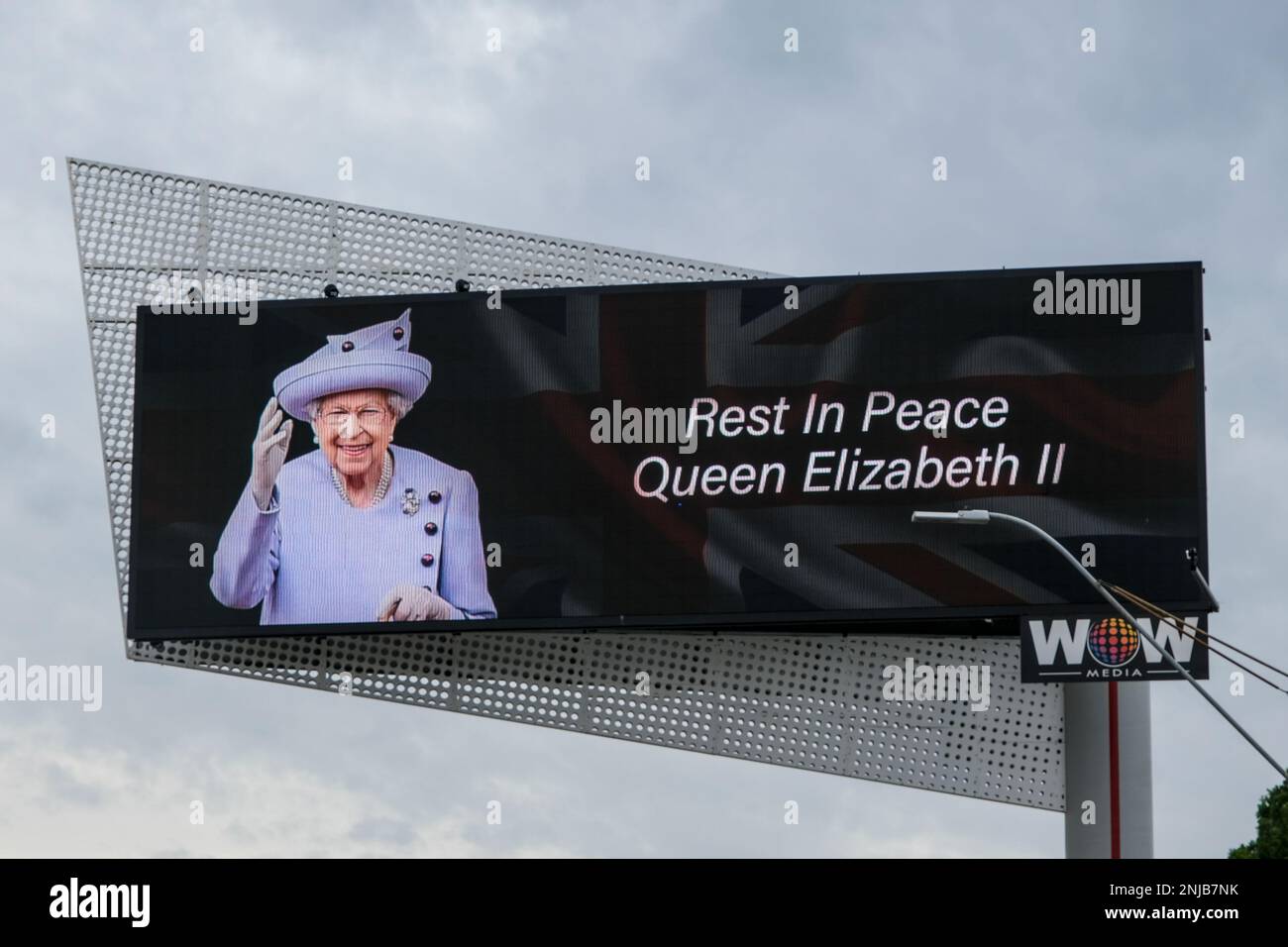A billboard honoring Queen Elizabeth II with the words "Rest in Peace ...